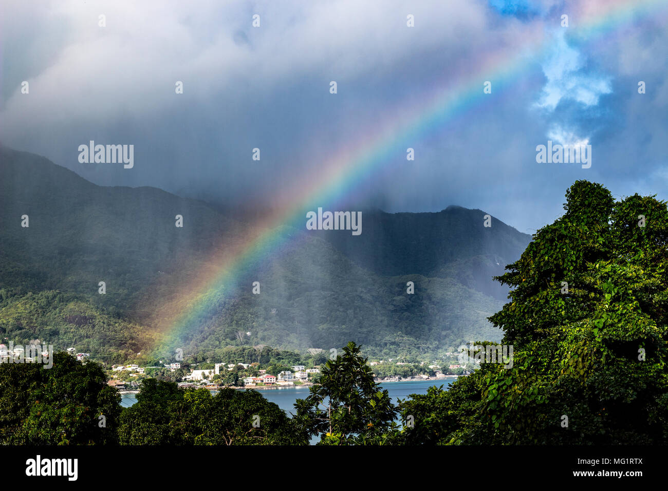 Rainbow clouds rain sun blue sky hi-res stock photography and images ...