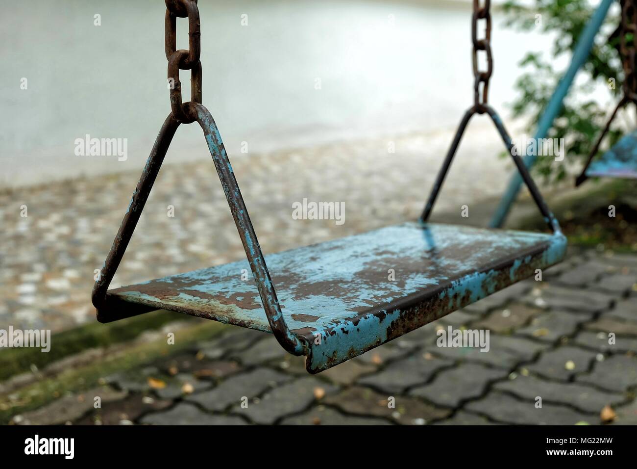 Old metal swing set hi-res stock photography and images - Alamy