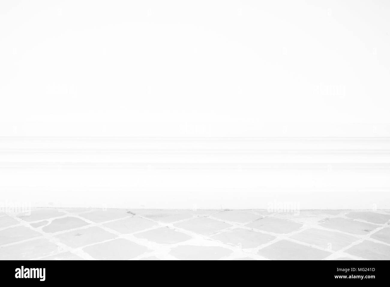 White Concrete Wall with Pavement Stock Photo - Alamy
