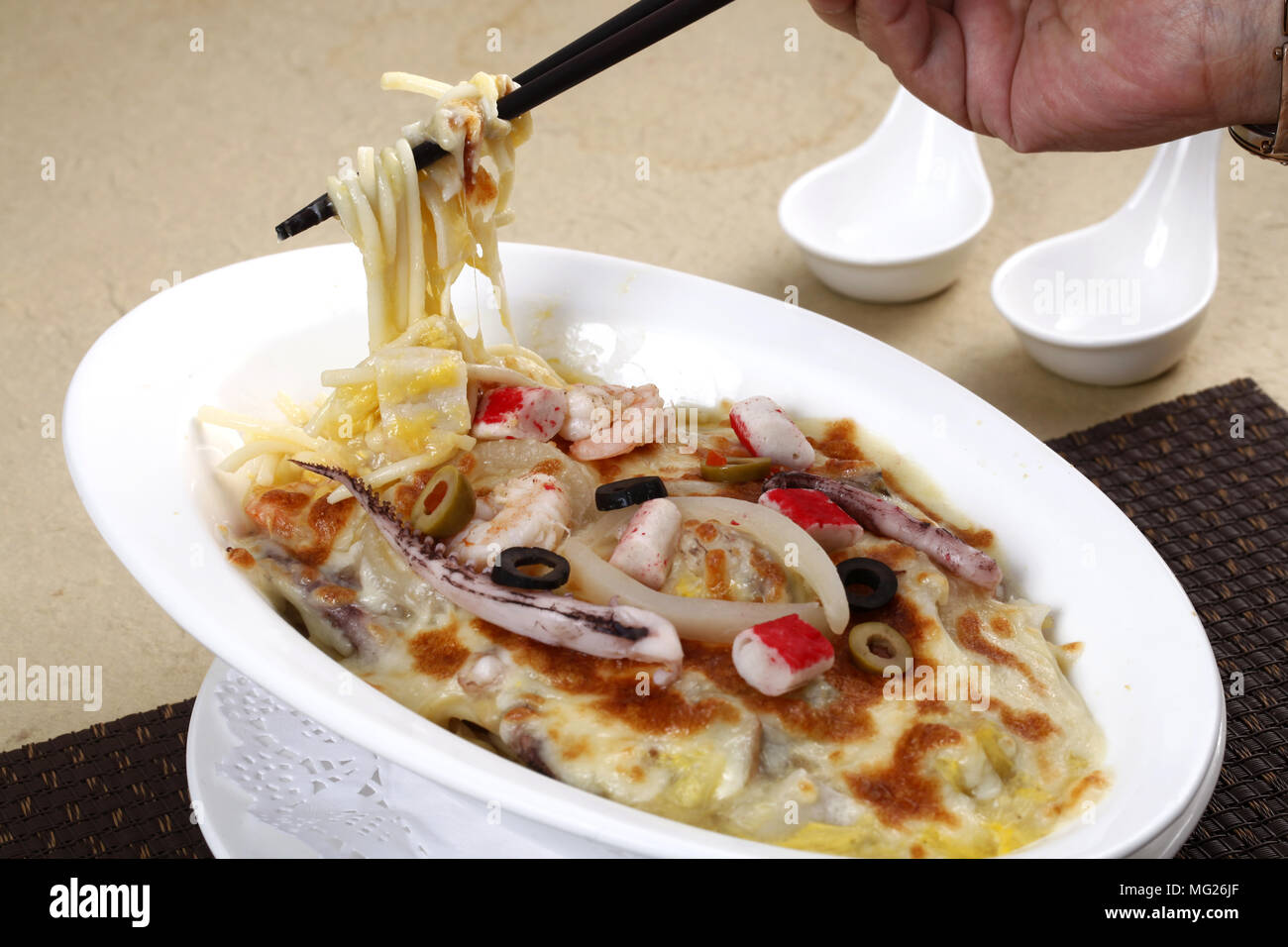 baked seafood risotto Stock Photo - Alamy
