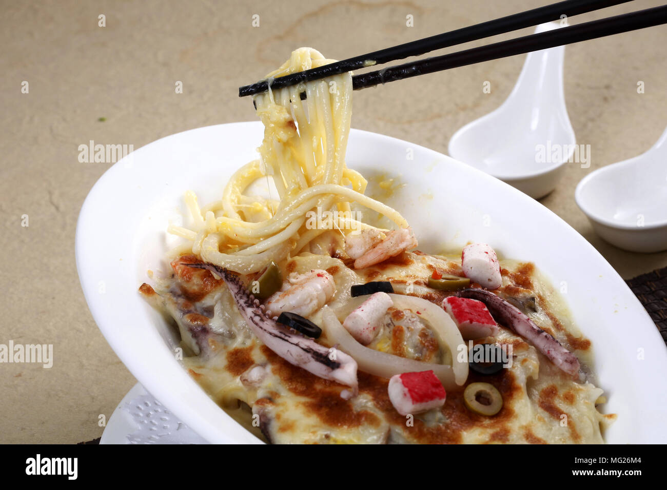 baked seafood risotto Stock Photo - Alamy