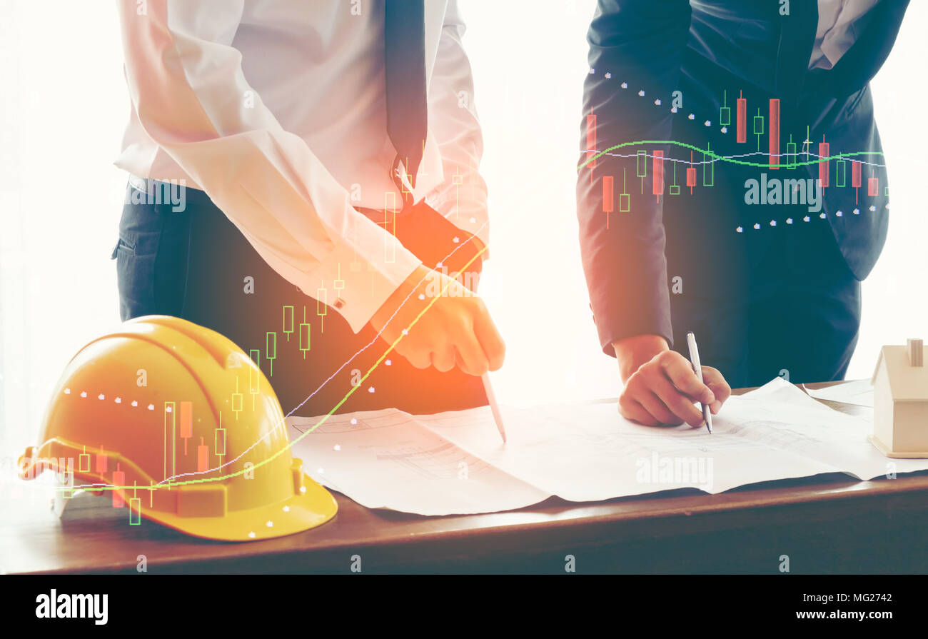 two engineer discuss about construction plan on table double exposure ...