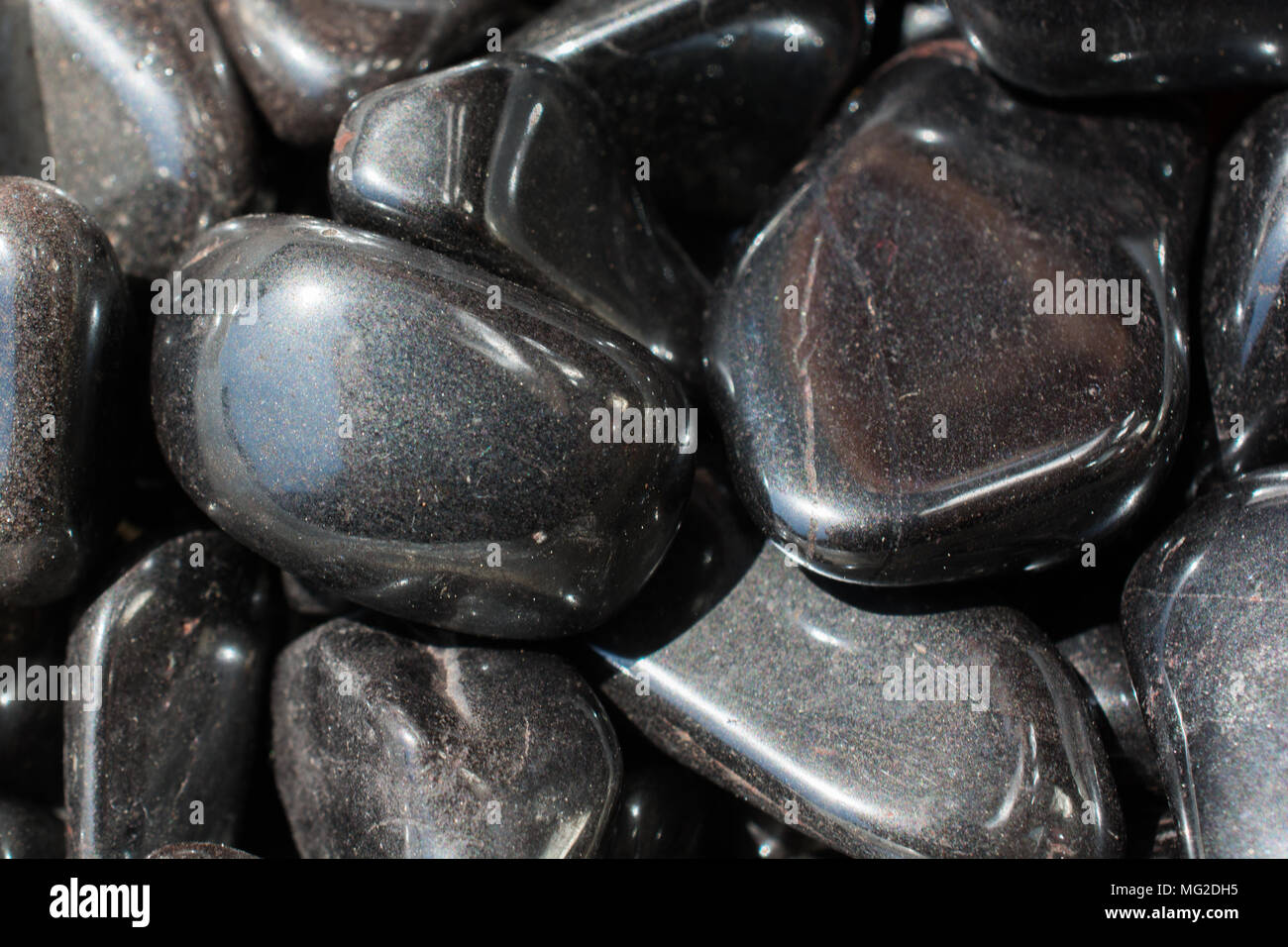 Shiny metallic gray tumbled hematite gemstone as mineral rock Stock ...