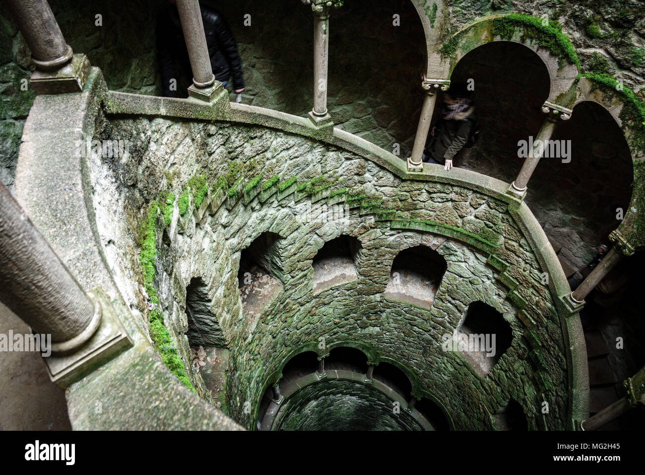 The Initiation Well pattern with two blurred tourists Stock Photo - Alamy