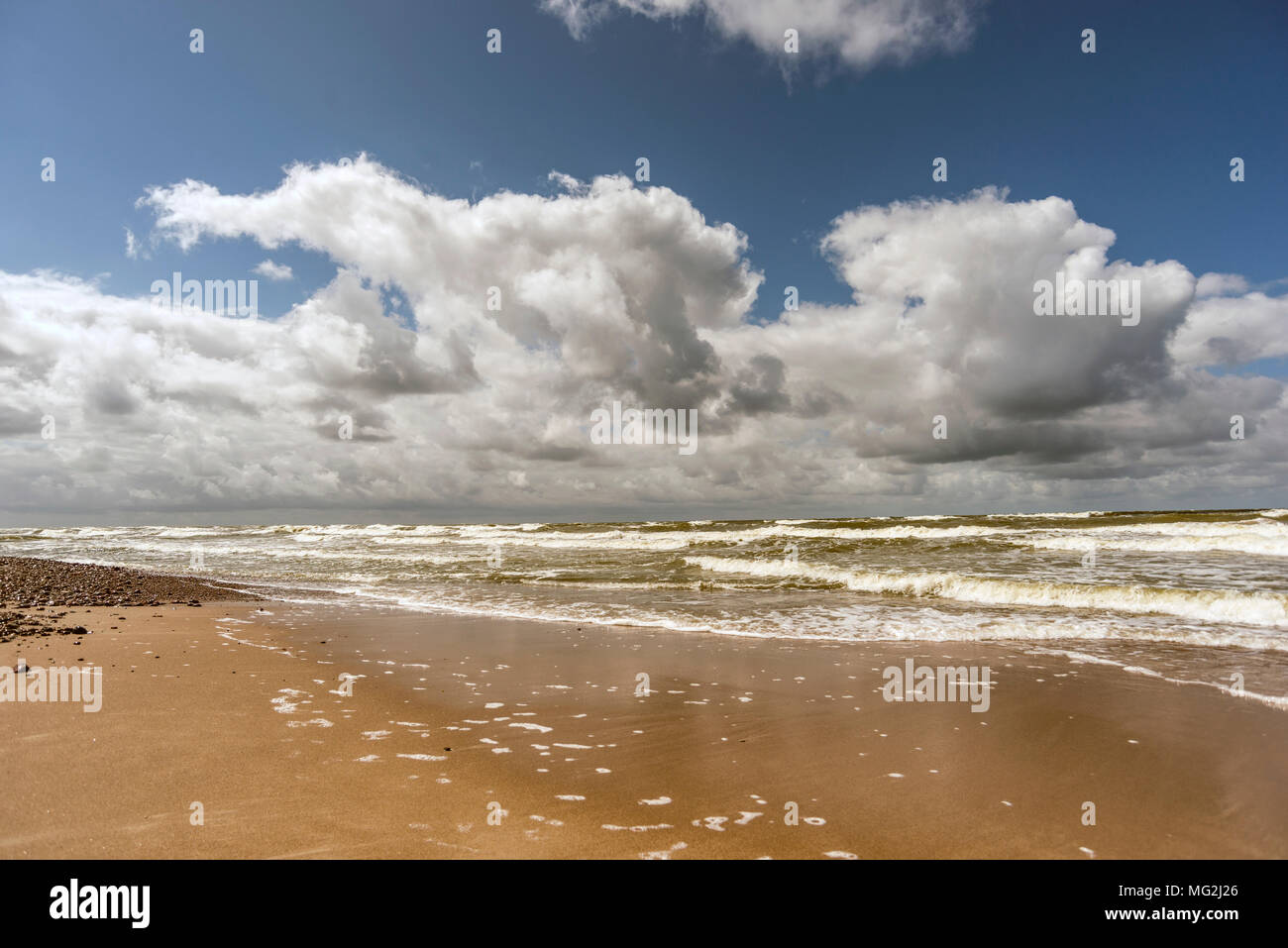 stormy sea by sunny weather at the empty sand beach Stock Photo - Alamy