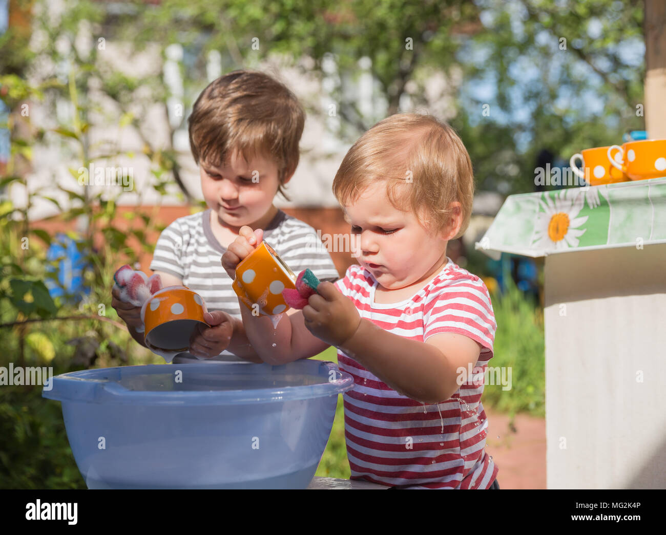 Children doing housework hi-res stock photography and images - Alamy