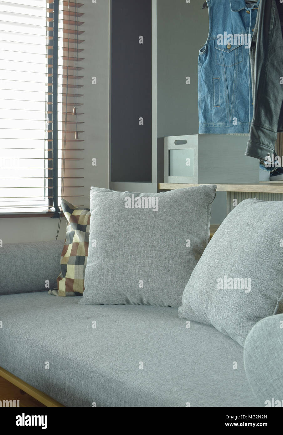 Gray color cushion with wooden bade and pillows Stock Photo - Alamy