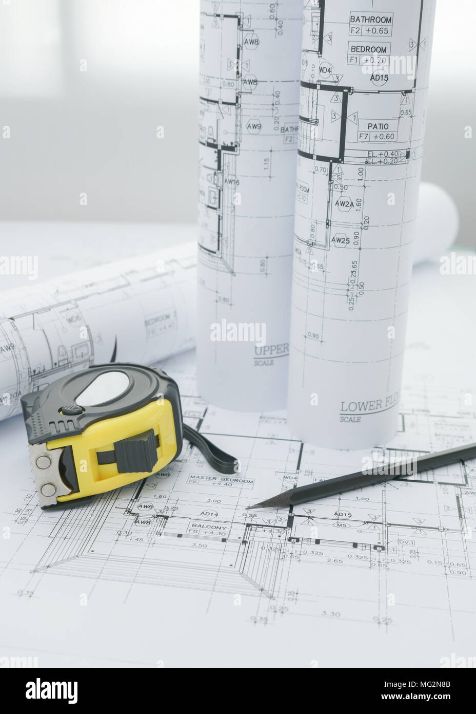 architects workplace - architectural blueprints with measuring tape and ...