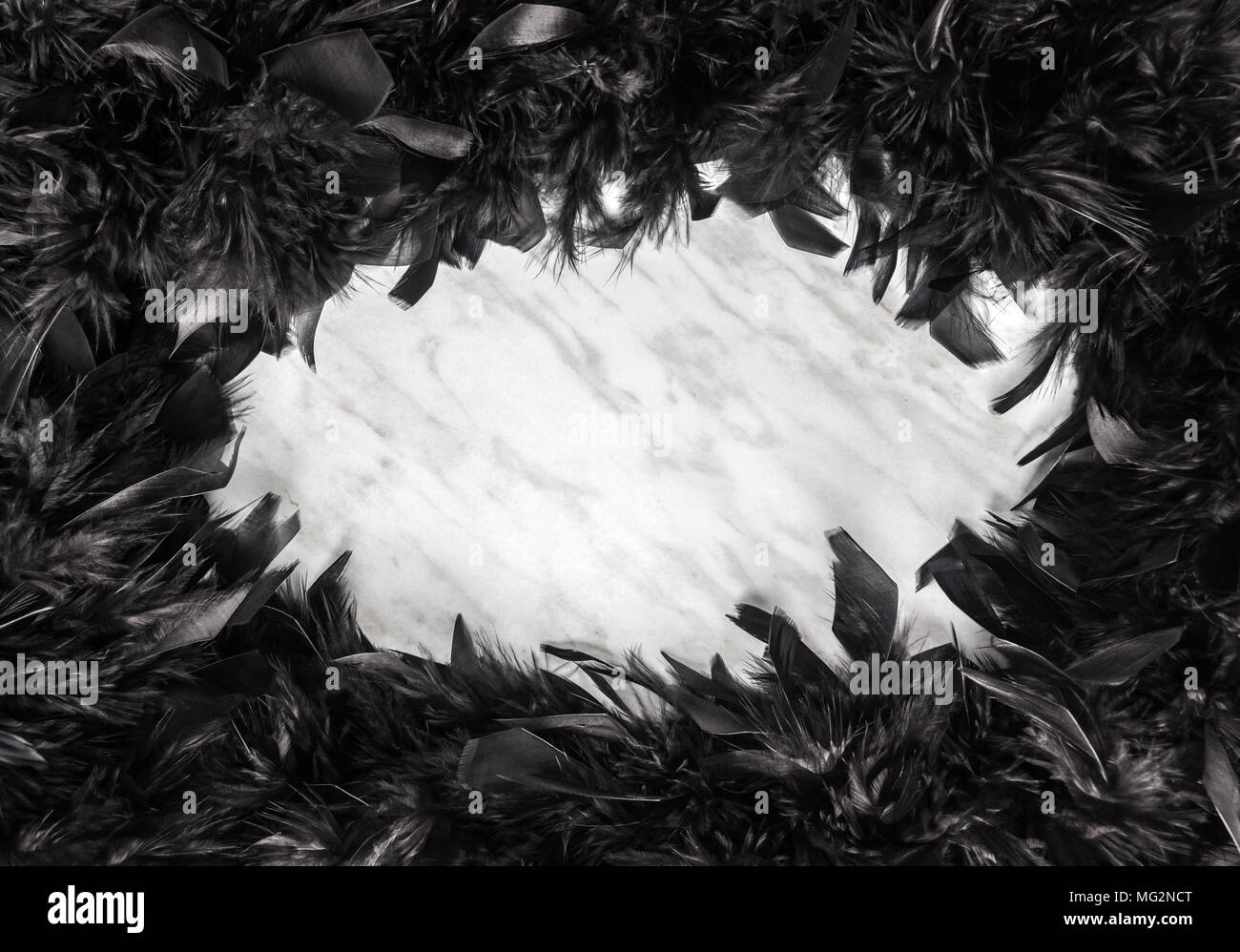 Black feather frame on marble background, with copy space Stock Photo ...