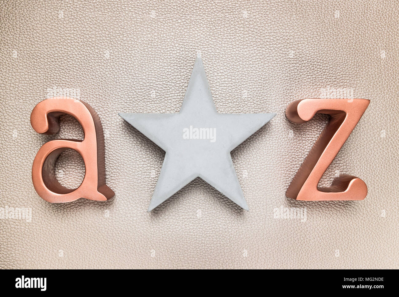 Concrete star and metal letters A and Z, on leather background Stock ...