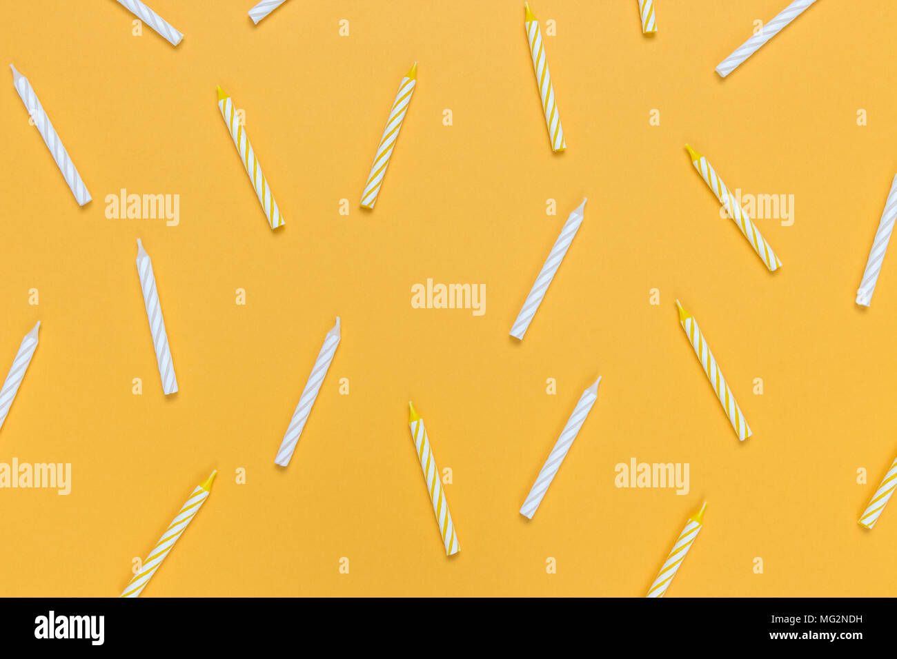 Birthday candles on bright yellow background. Flat lay composition ...