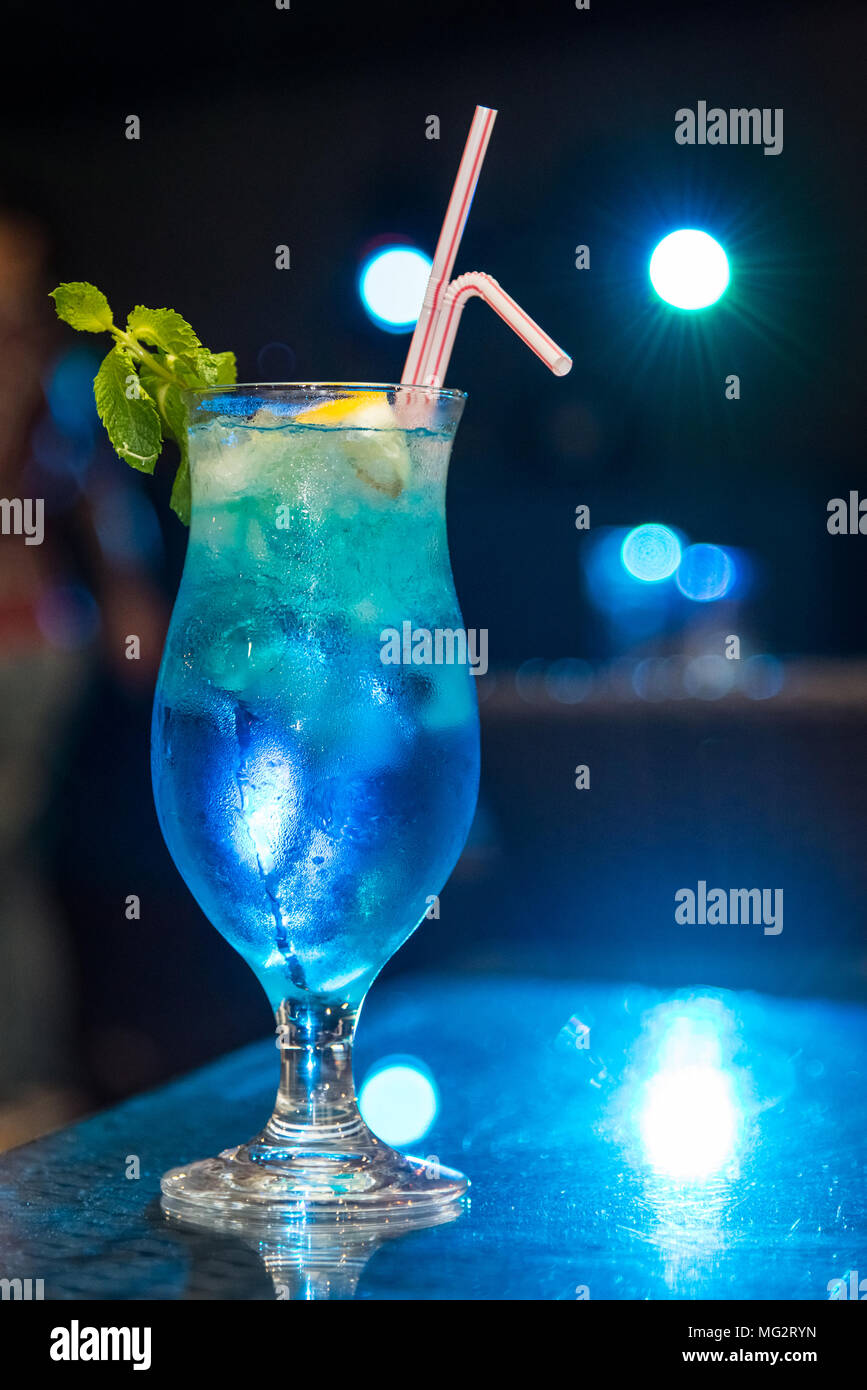 Cool blue cocktail on a blurry background Stock Photo - Alamy
