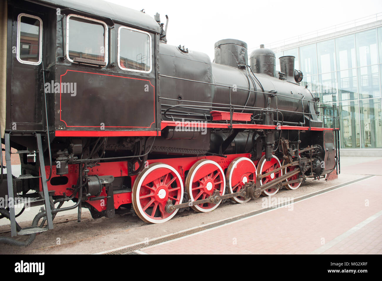 Black retro steam locomotive with red wheels Stock Photo - Alamy