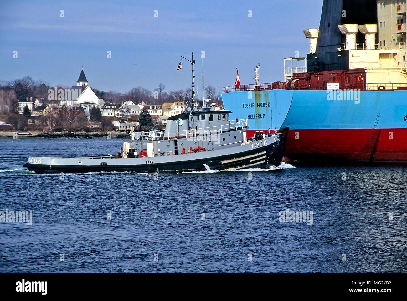 Tug boat guiding ship hi-res stock photography and images - Alamy