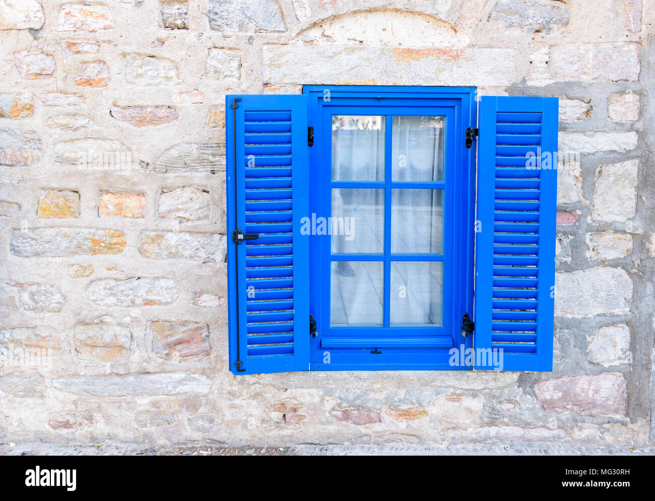 View of blue window with white stone wall background in Bodrum,Turkey ...