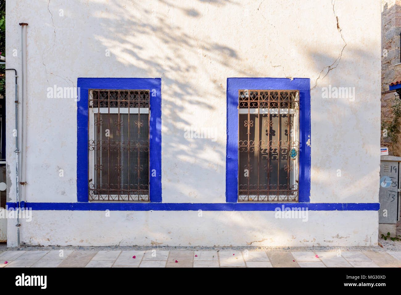 View of blue window with white stone wall background in Bodrum,Turkey ...