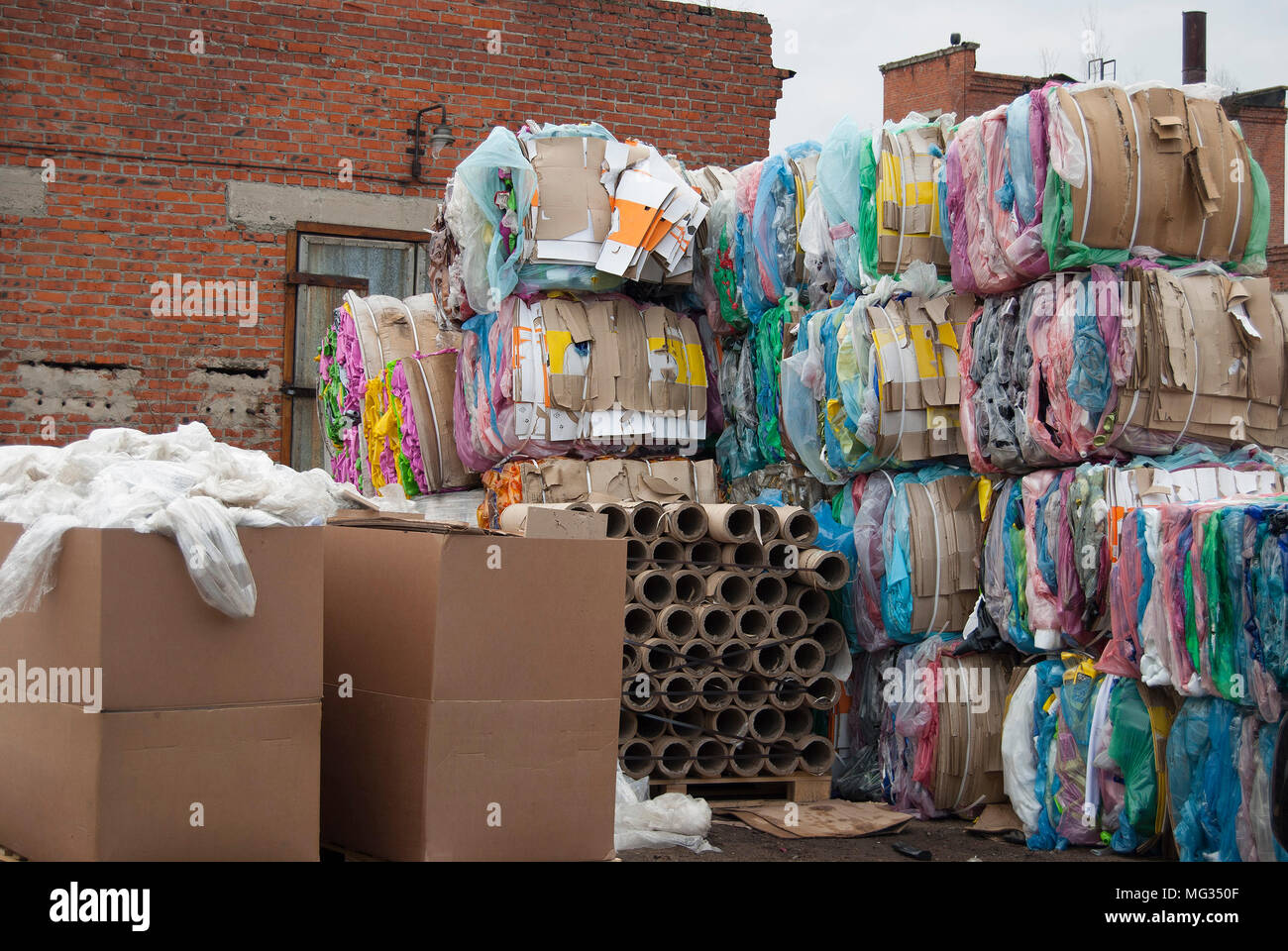Garbage for recycling: cardboard, paper, plastic in a recycling factory ...