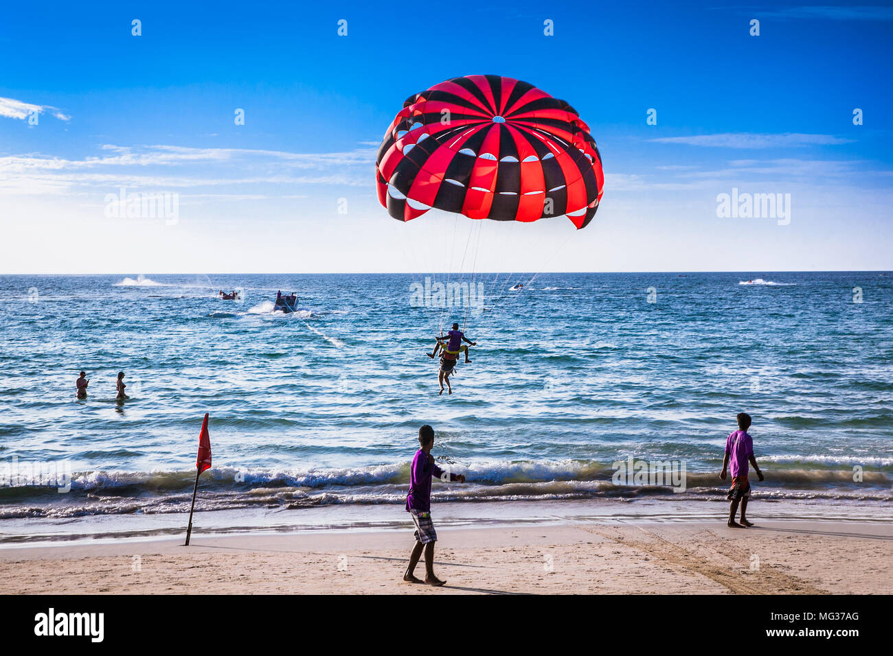 PHUKET, THAILAND - JAN 23, 2016: Tourists playing parasailing on Patong ...