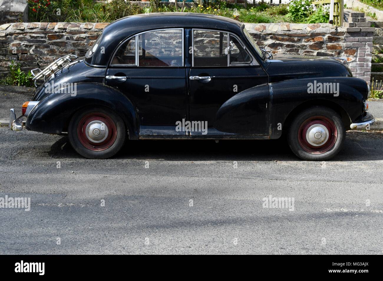 Morris Minor 1000 with baggage rack parked in Tywardreath Stock Photo ...