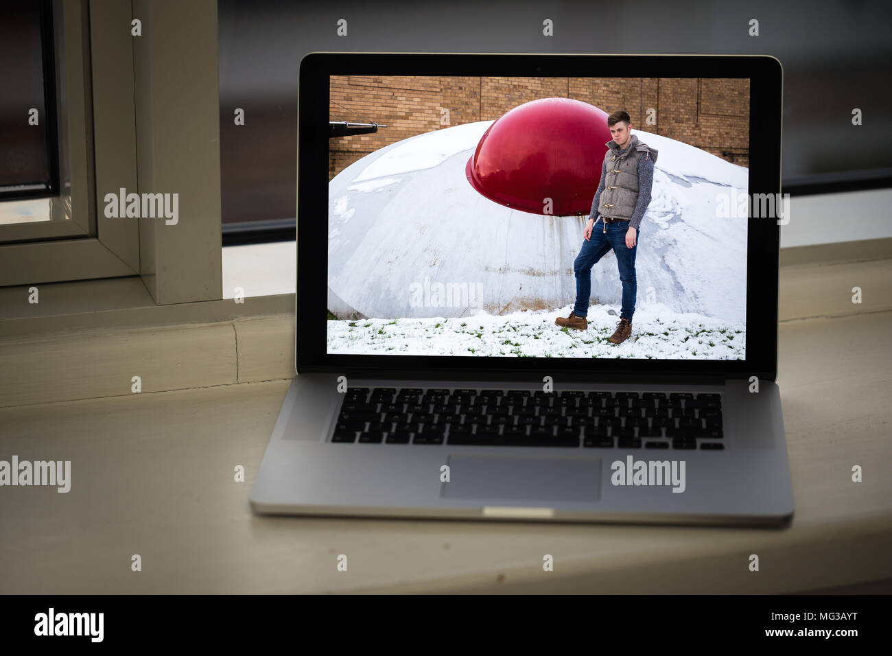 Male modern fashion shoot, shown on laptop screen Stock Photo - Alamy