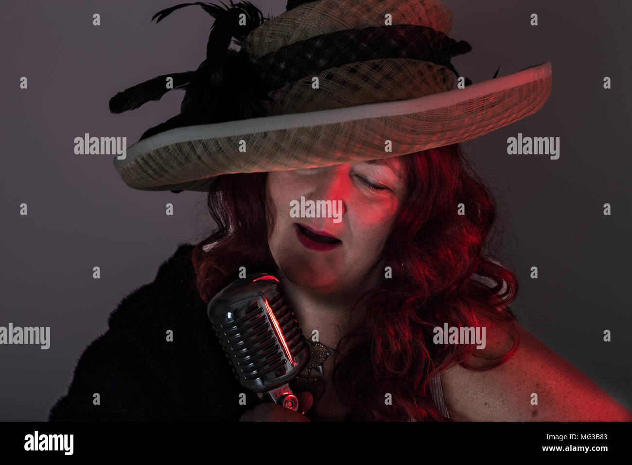 Female singer with red hair hi-res stock photography and images - Alamy