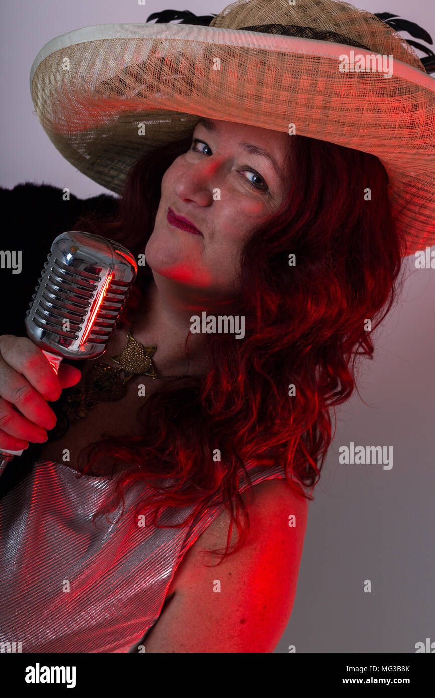 Female singer with red hair hi-res stock photography and images - Alamy