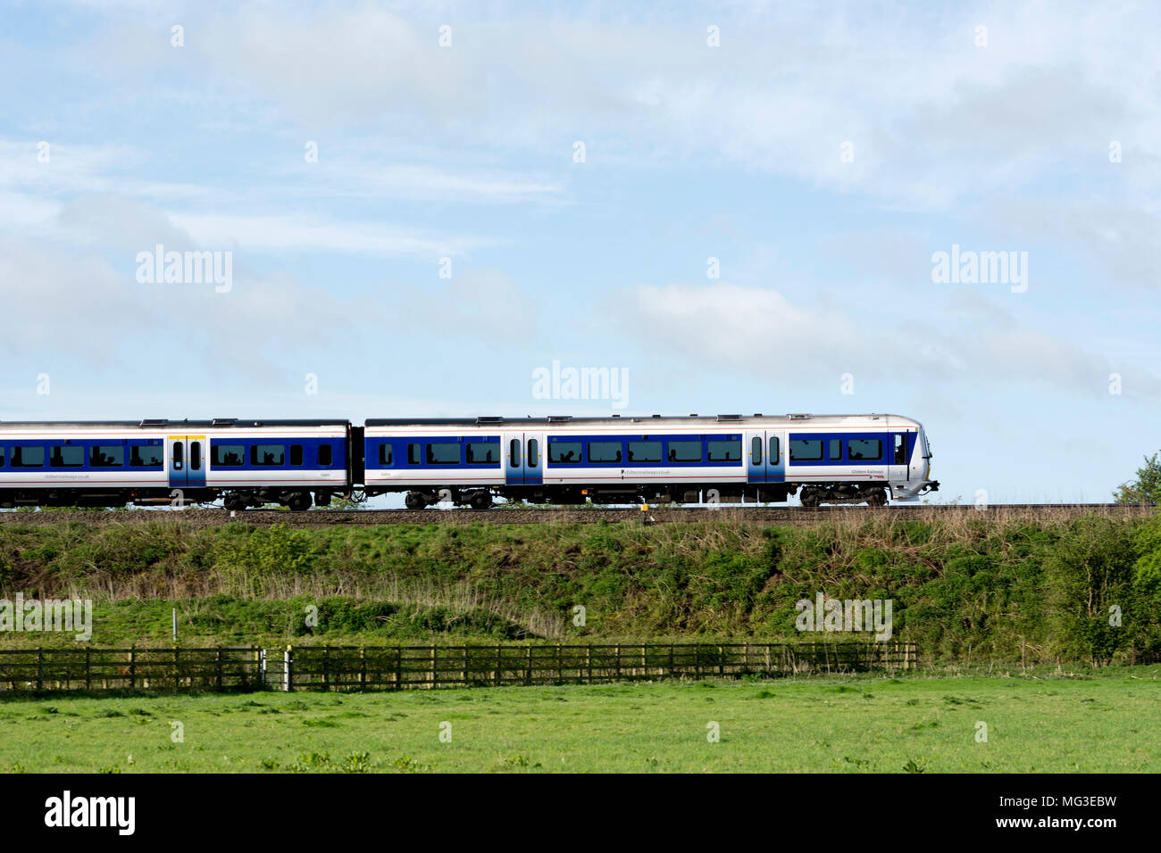 Chiltern Railways class 165 diesel train, side view on an embankment ...