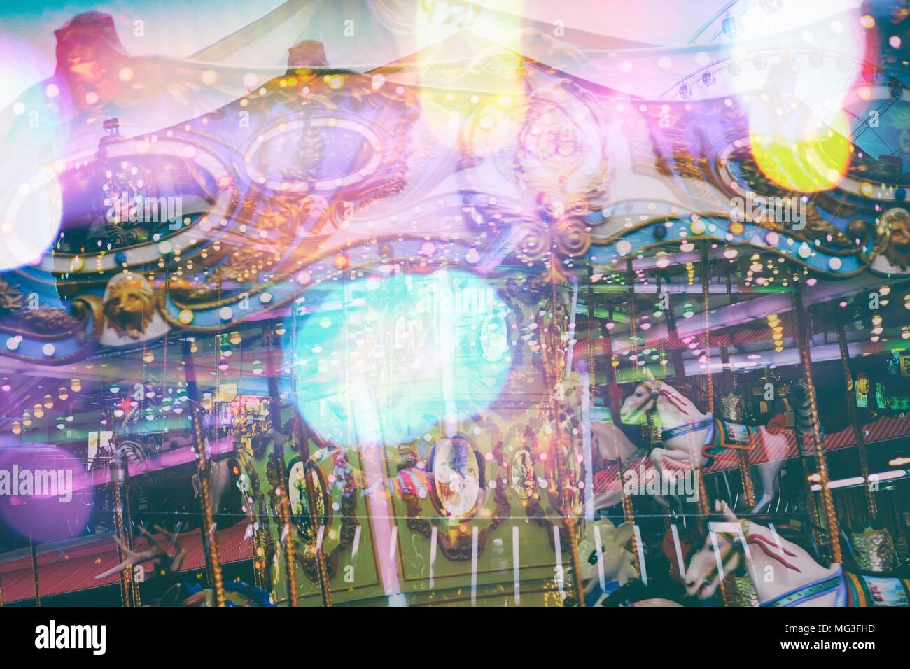 Abstract Double Exposure Carousel with Bokeh Background Stock Photo - Alamy