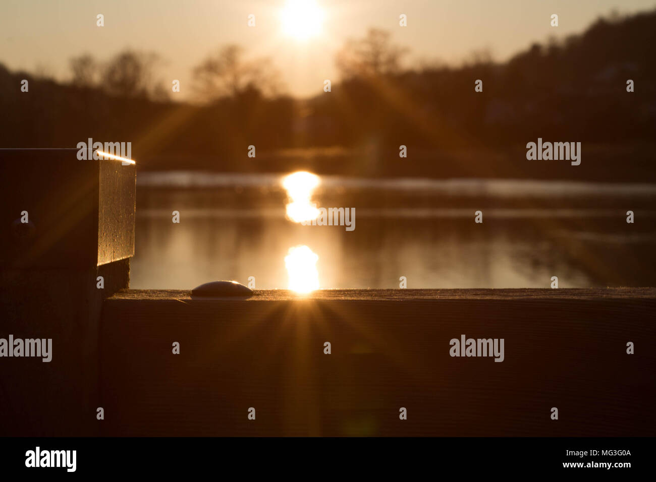 Flare at sunset Stock Photo - Alamy