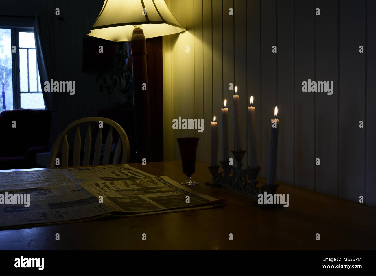 READING BY CANDLE LIGHT Stock Photo - Alamy