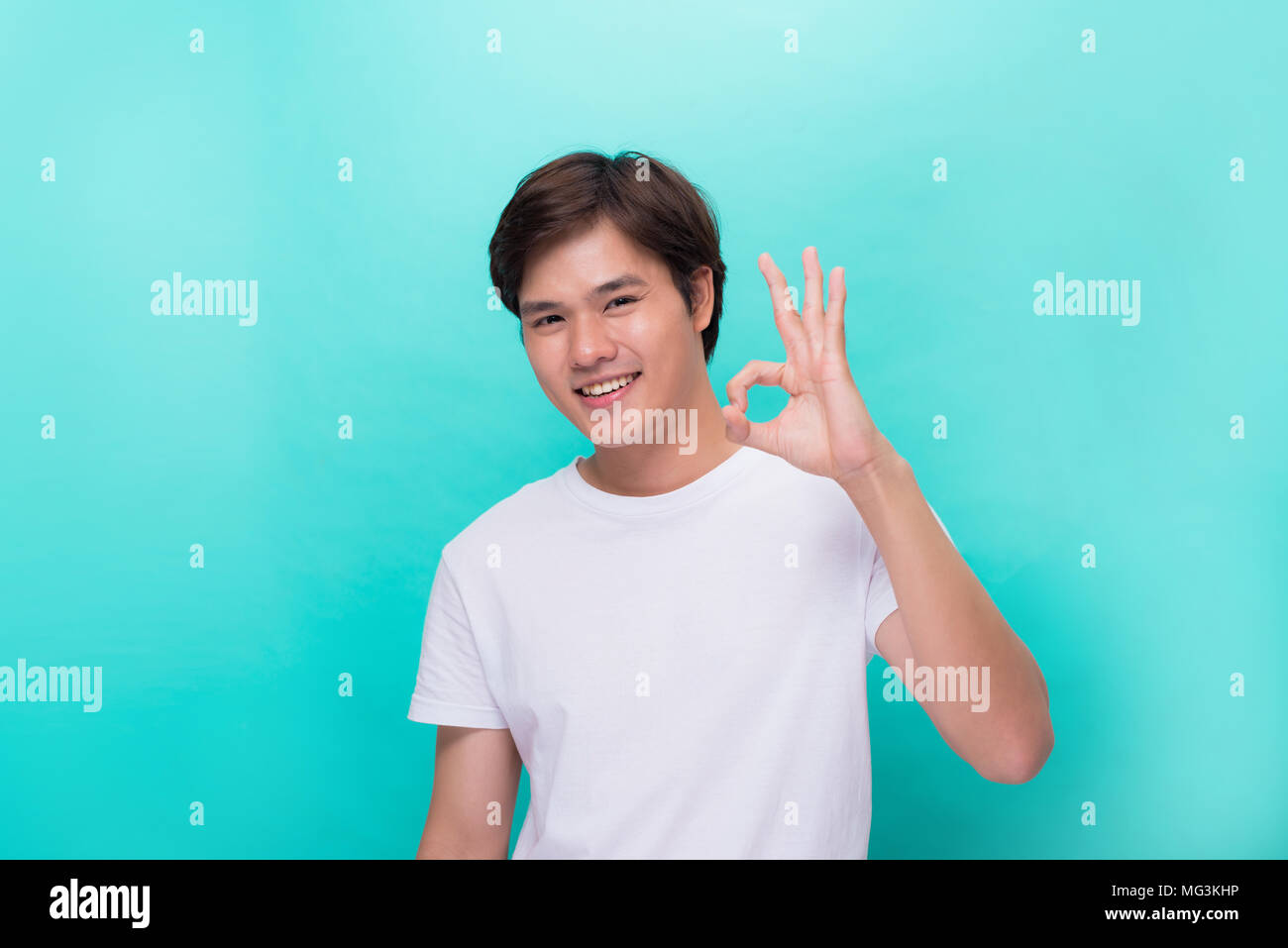 Handsome asian man gesture OK sign Stock Photo - Alamy