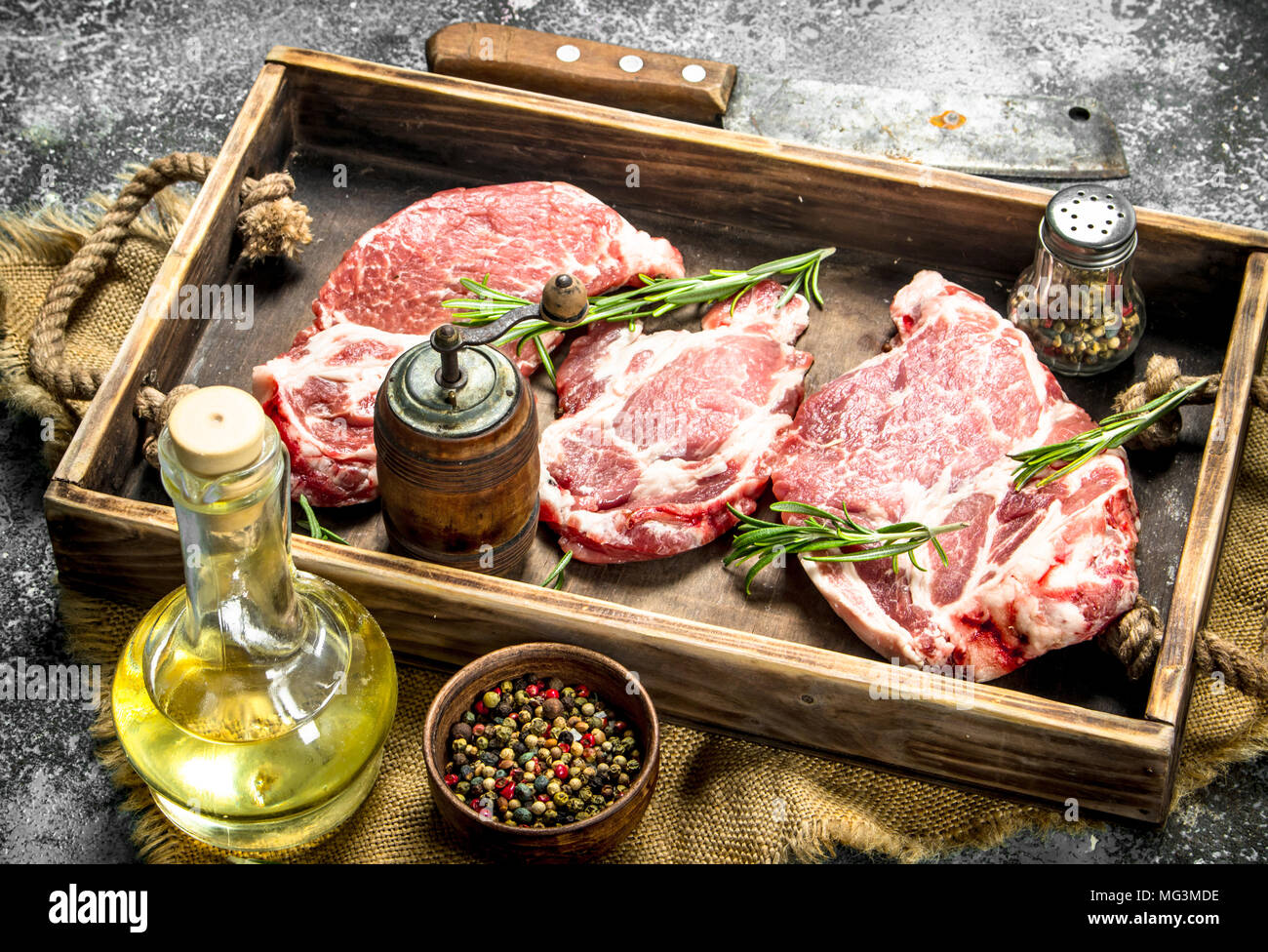 Raw beef with herbs and spices. On rustic background Stock Photo - Alamy