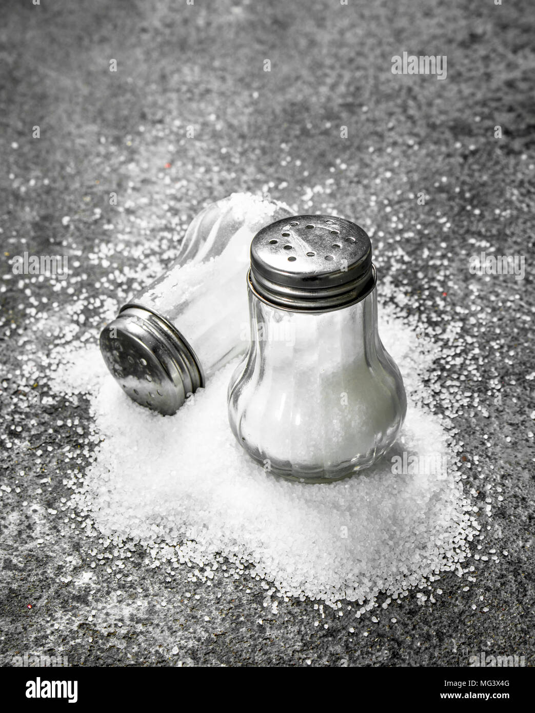 Salt in glass. On rustic background Stock Photo - Alamy