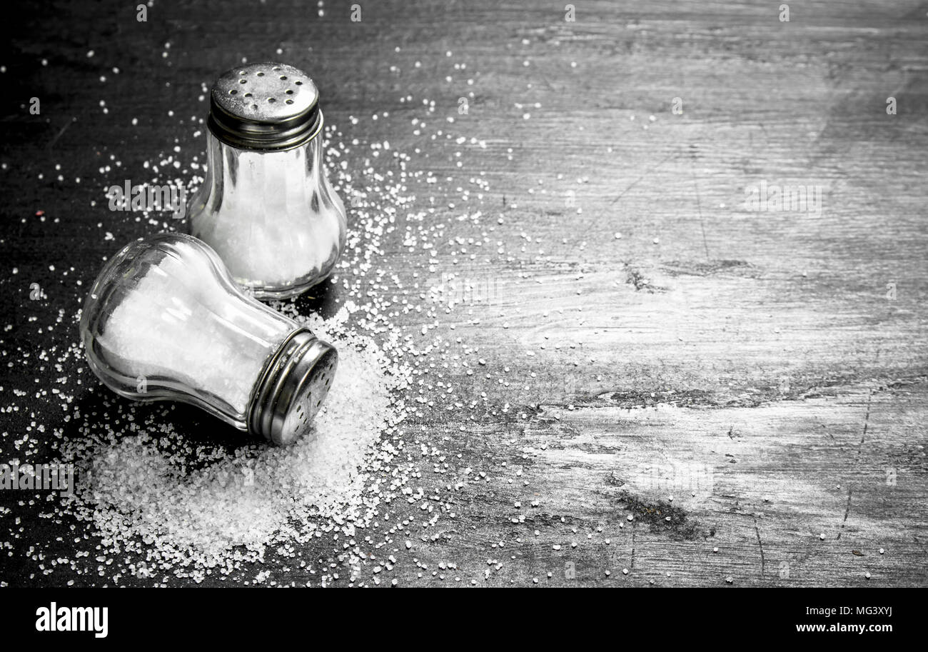 Salt in glass. On the black chalkboard Stock Photo - Alamy