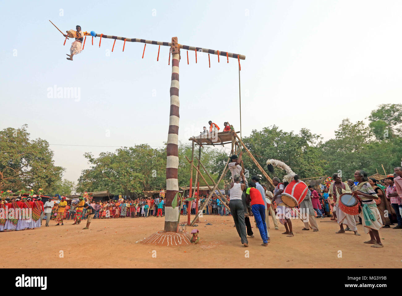 Charak Puja, Bangladesh. 26th April 2018. A devotee hanging from a pole ...