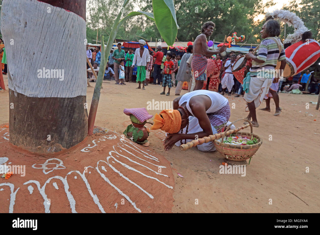 Charak Puja, Bangladesh. 26th April 2018. A young tribal devotee ...