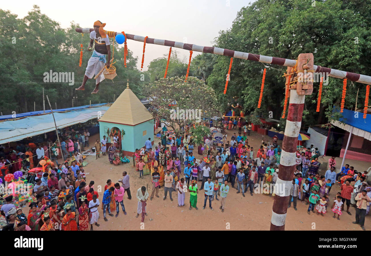 Charak Puja, Bangladesh. 26th April 2018. A young devotee hanging from ...