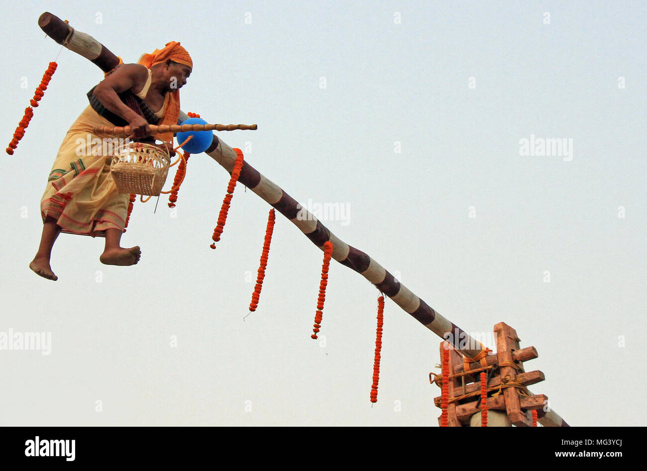 Charak Puja, Bangladesh. 26th April 2018. A devotee hanging from a pole ...