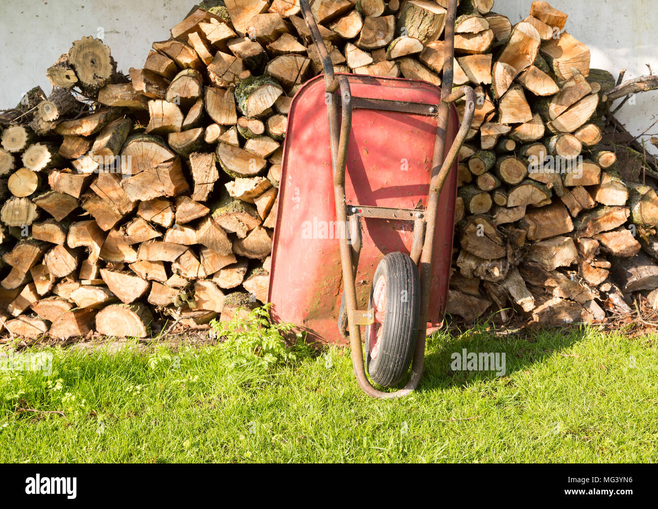 Old wood wheelbarrow in garden hi-res stock photography and images - Alamy