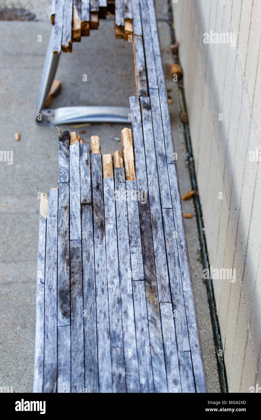 a broken bench sitting outside lost and forgotten Stock Photo - Alamy