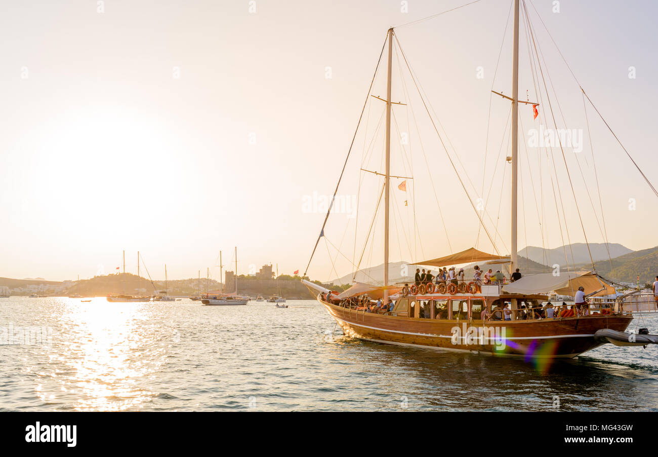 Unidentified people go sailing or boat tour at marine in Bodrum harbor ...