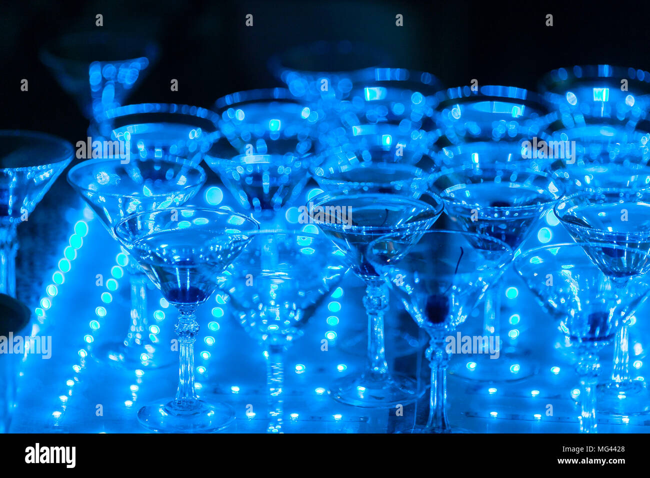 Champagne glass pyramid on wedding party. Tower of glasses of wine ...