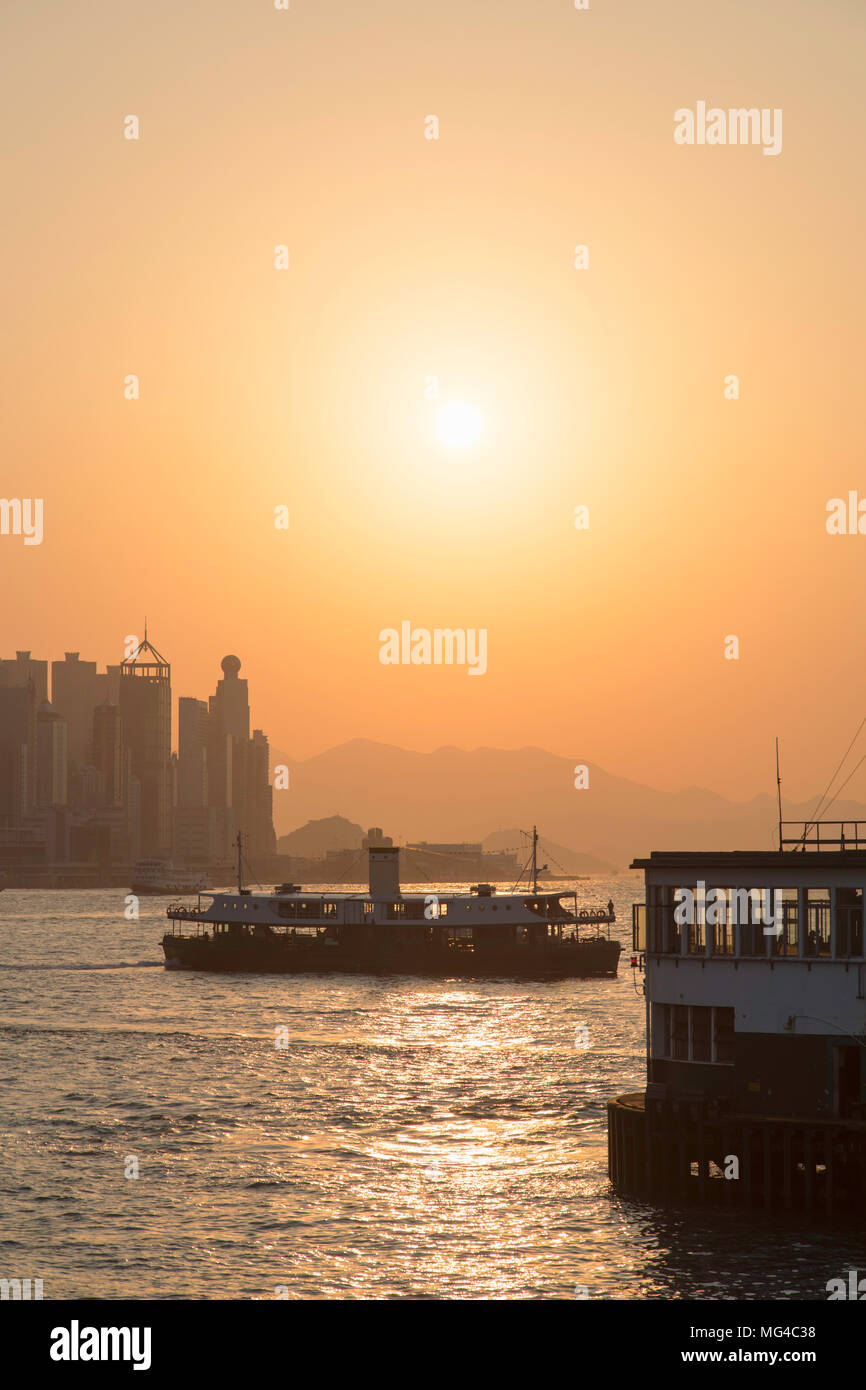 Star Ferry in Victoria Harbour at sunset, Hong Kong Island, Hong Kong ...