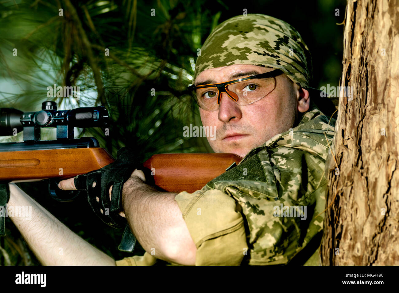image of a young man with an air rifle Stock Photo - Alamy