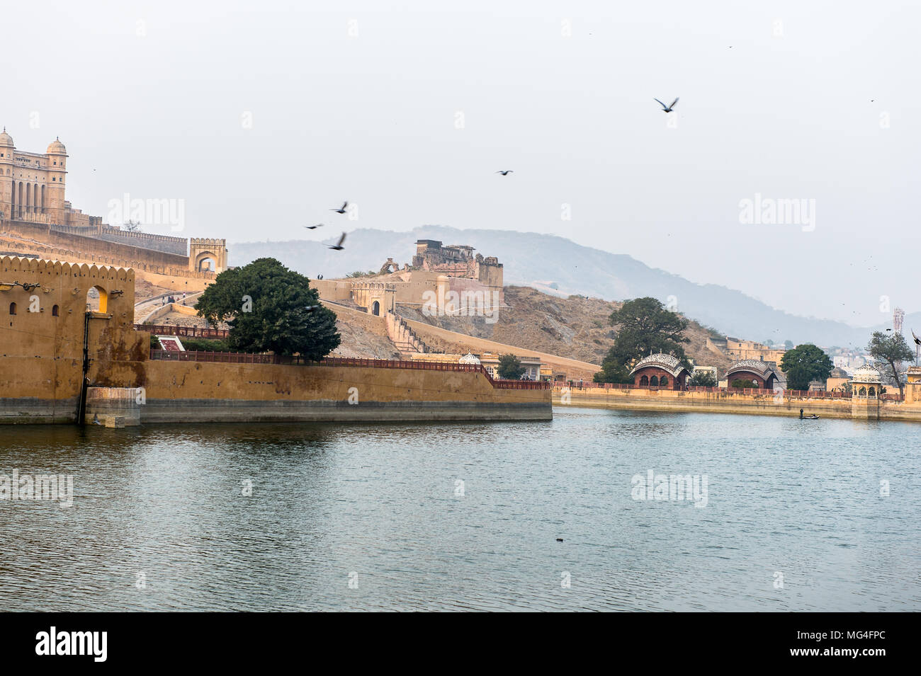 View of the Amer Fort (Amber Fort and Amber Palace) and the lake Jaipur ...