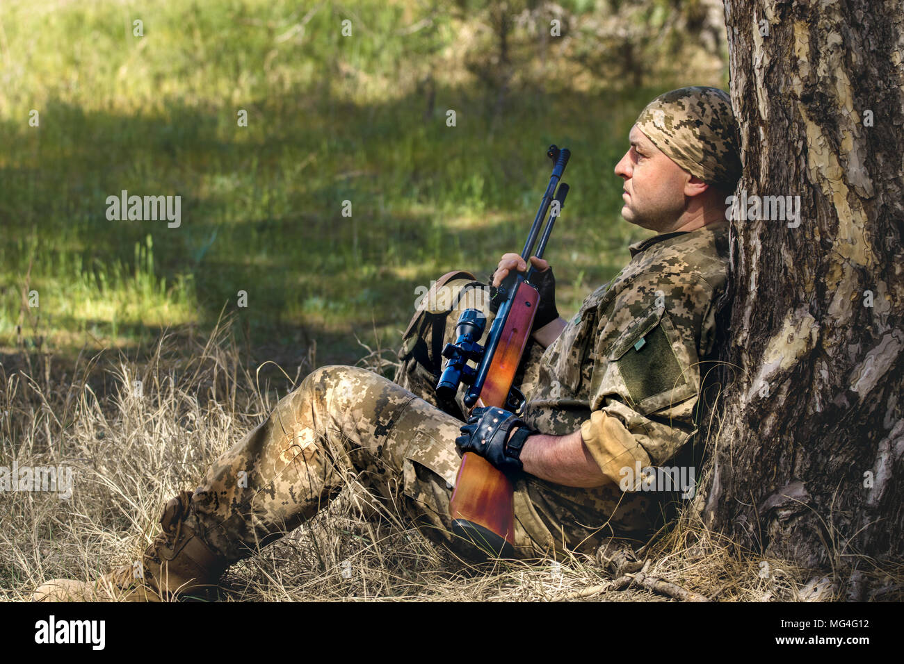Young man shooting rifle hi-res stock photography and images - Alamy