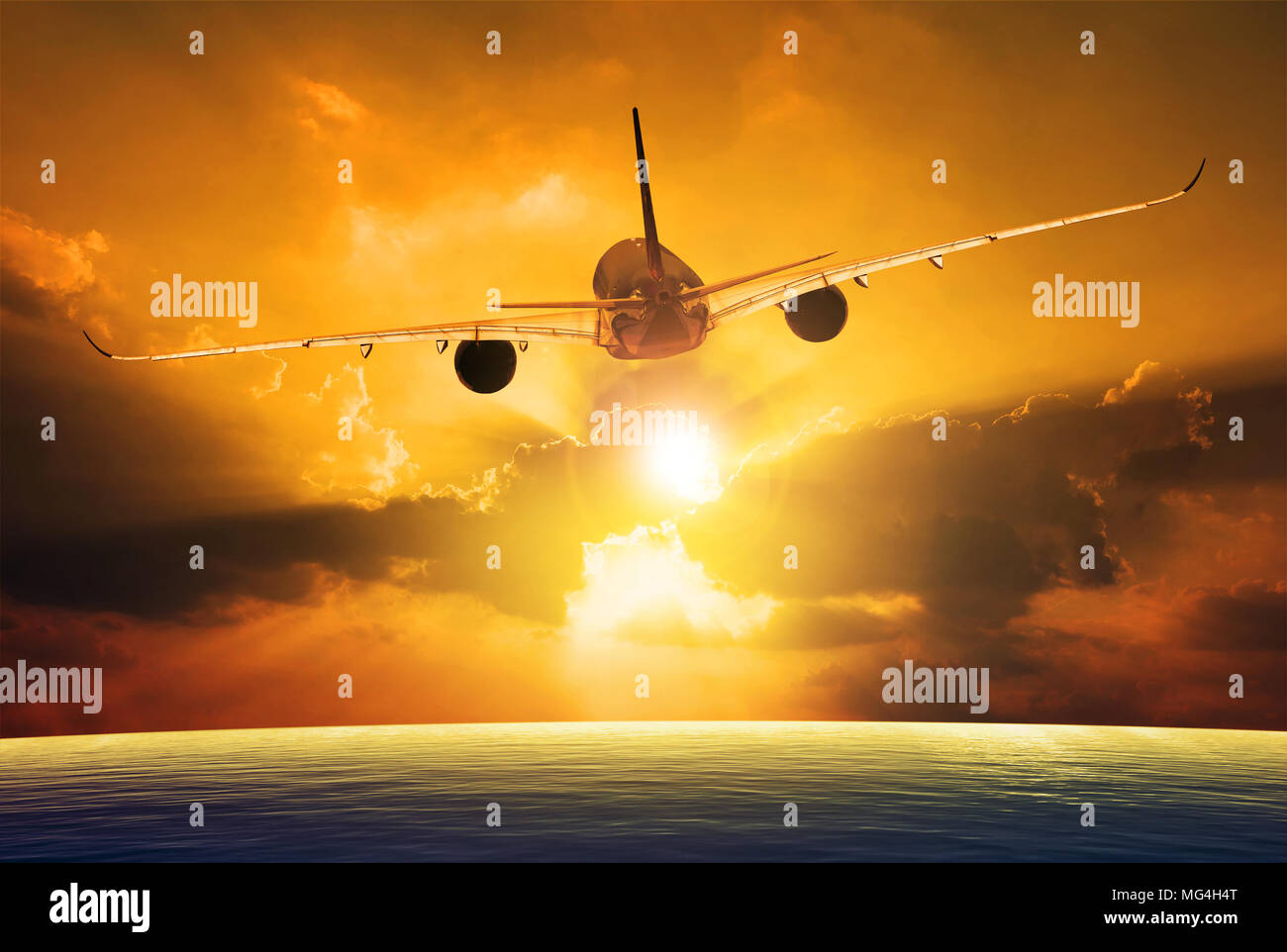 passenger plane flying over beautiful sunset sky Stock Photo - Alamy