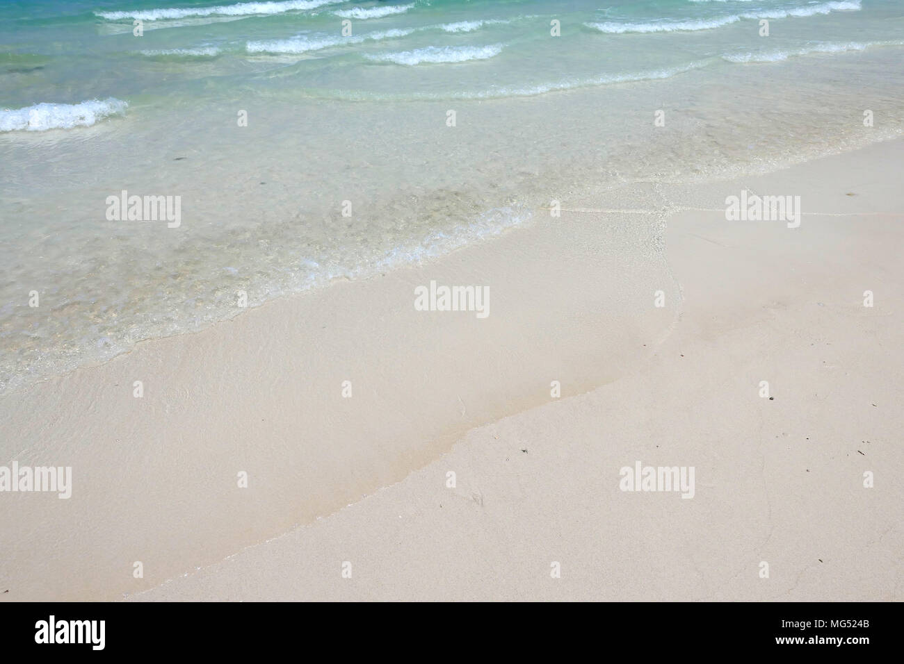 Beautiful tropical beach, waves on white sand Stock Photo - Alamy