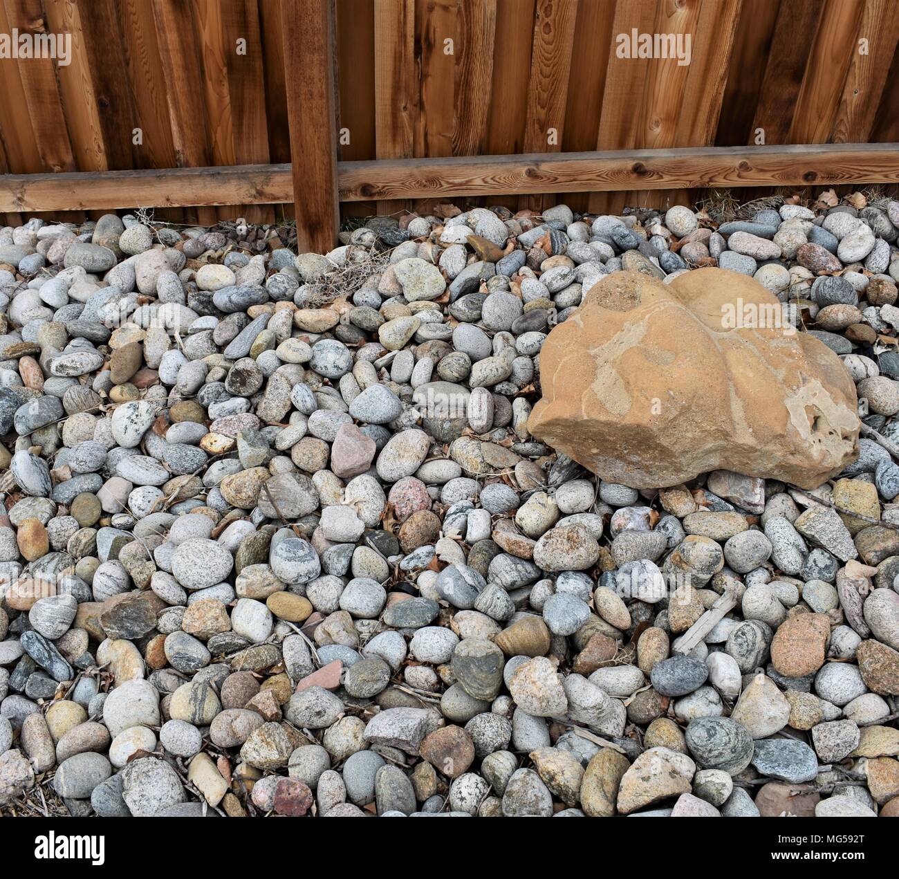 Rocks and fence Stock Photo - Alamy
