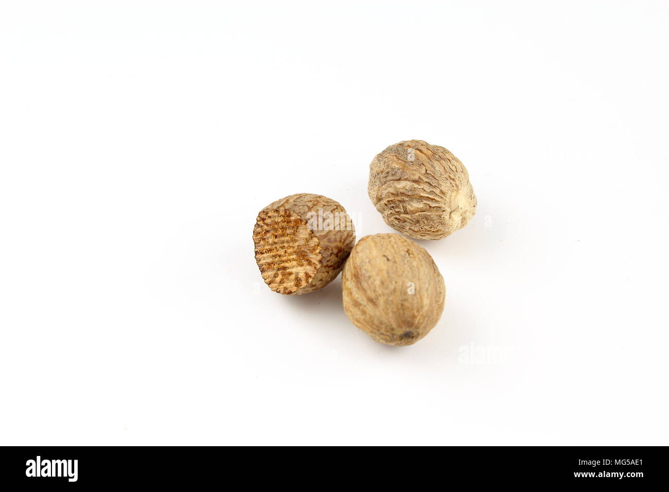 composition of nutmeg seeds isolated on a white background Stock Photo ...